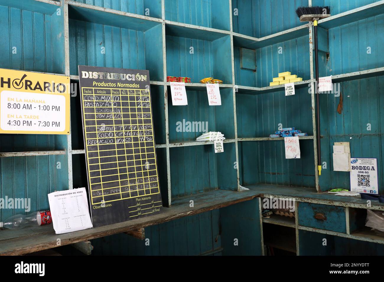 Social store bodega with half-empty shelves and goods sold by cards. La ...