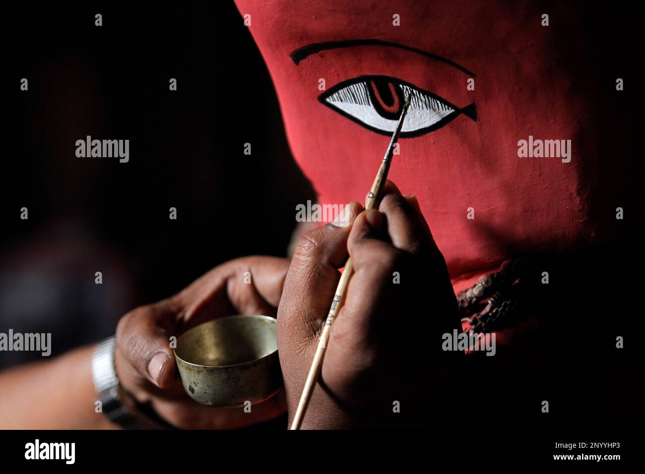 In this April 23, 2017, photo, a Chitrakar artist paints details on the ...