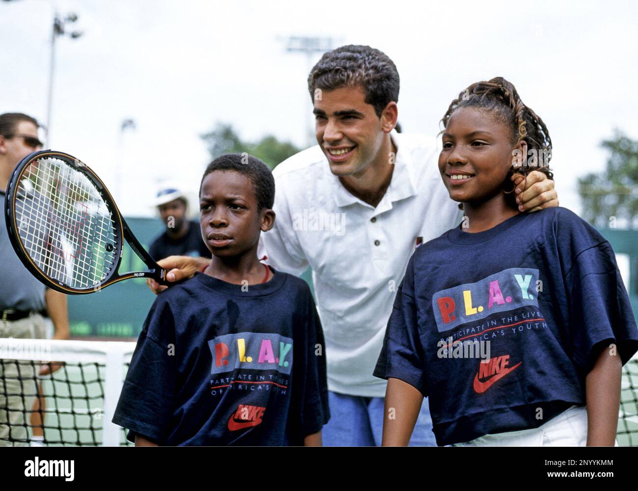 Pete Sampras poses with young fans at the 1995 US Open in Flushing ...