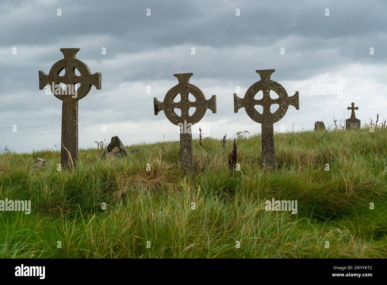 Picturesque gravestones with Celtic crosses at Cross Abbey graveyard ...