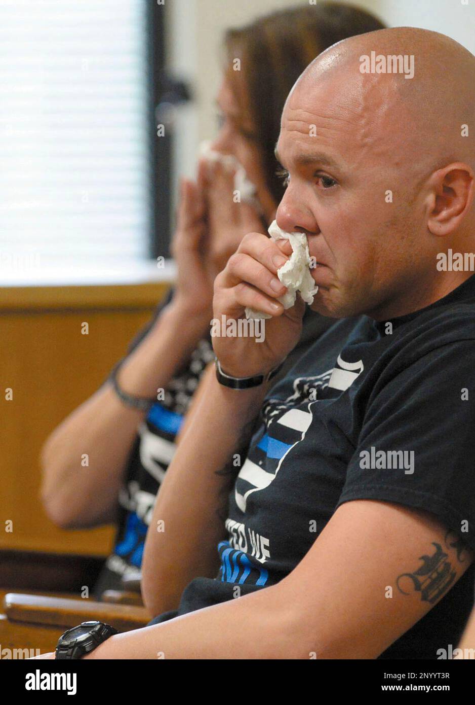 Tears roll down the face of Joey Whitehead, brother-in-law of Maryville ...