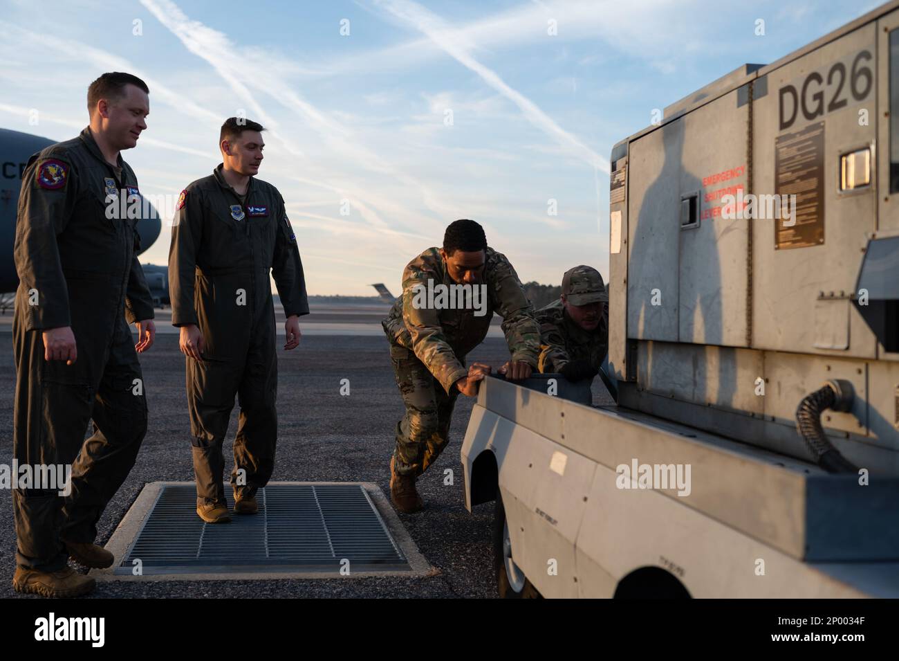 Aircrew members assigned to Joint Base Charleston aid in moving an ...