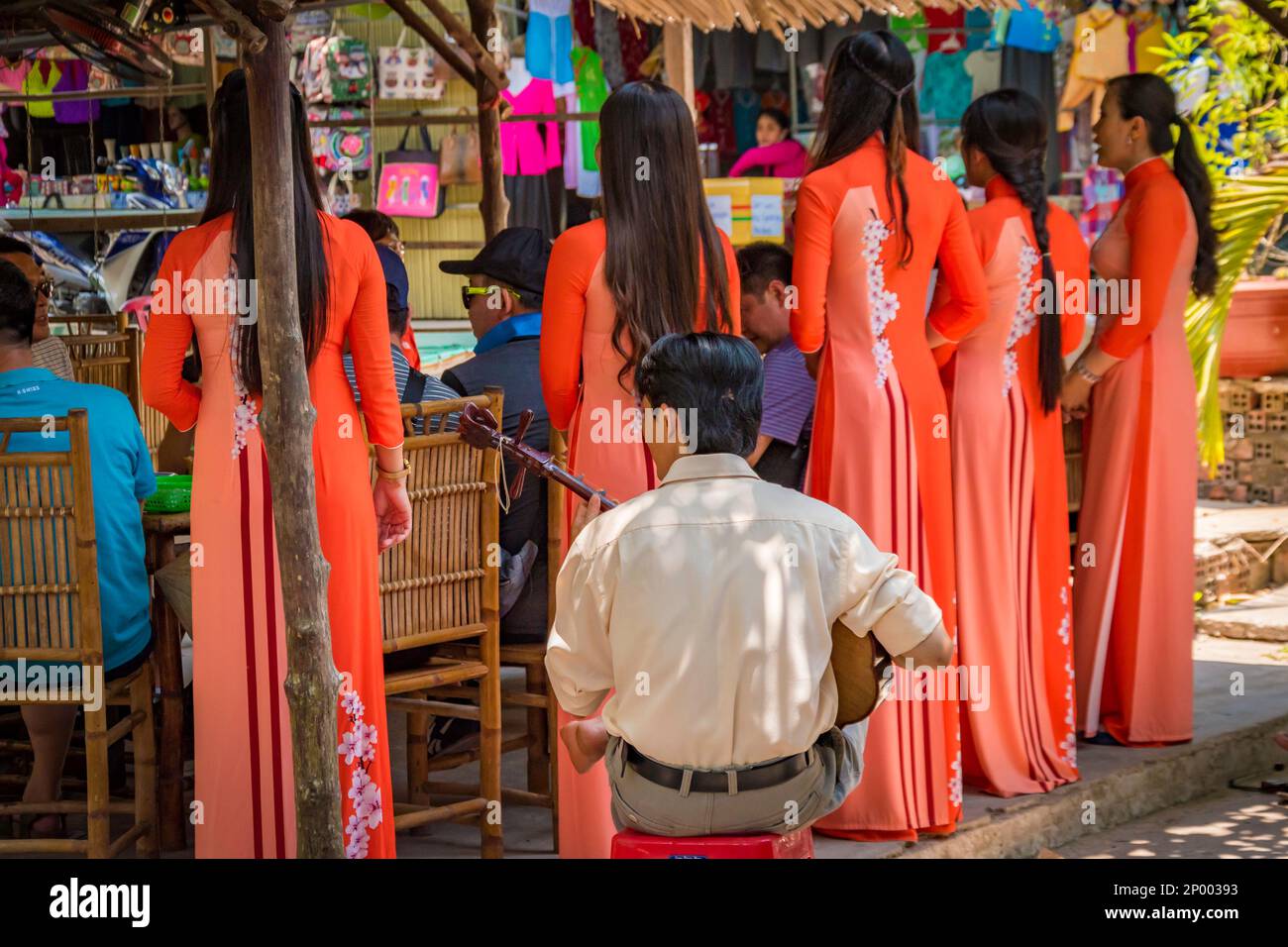 Traditional Don ca tai tu singers singing folk songs and a guitarist ...
