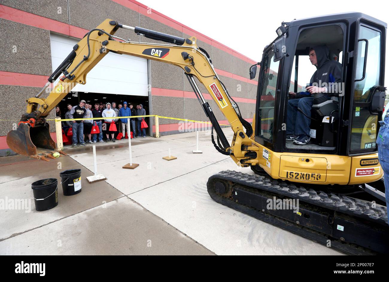 Zach Ingersoll, a junior at Cuba City (Wis.) High School, maneuvers a mini-excavator Thursday ...