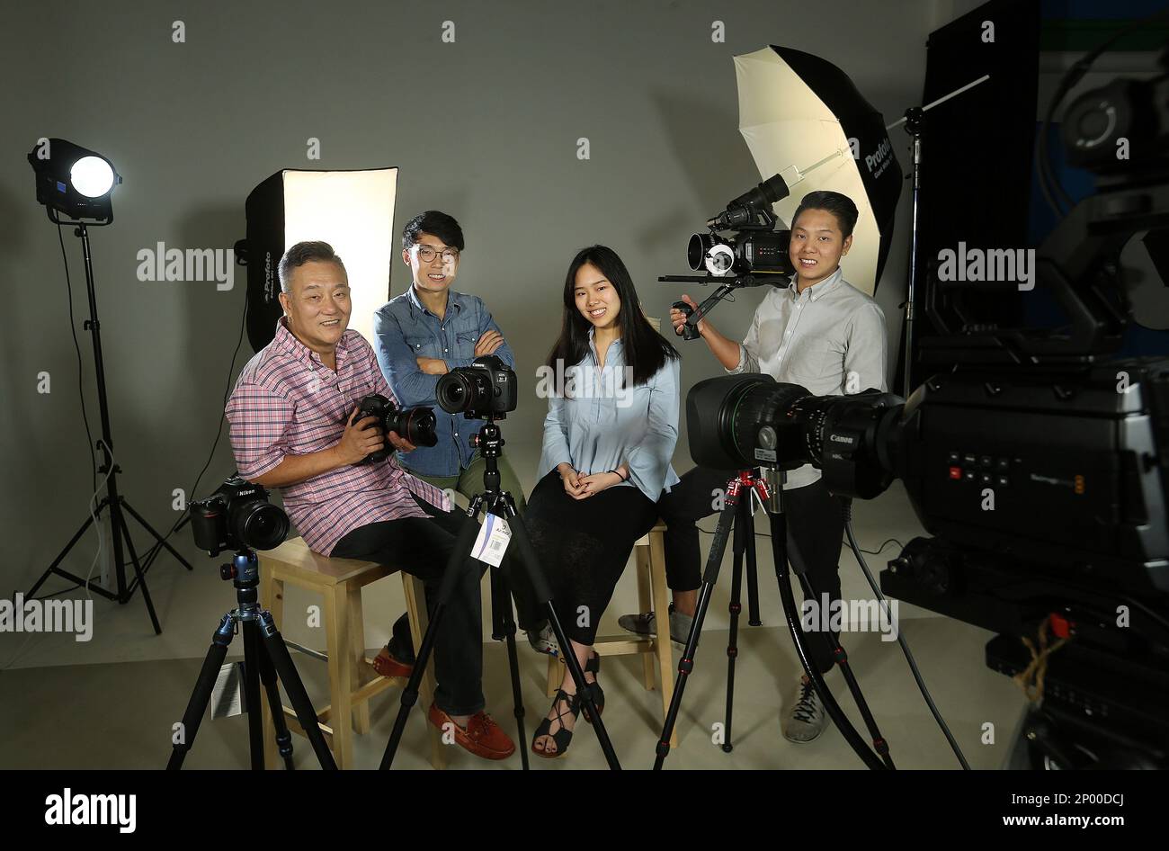 Alan Photo founder Alan Tan with his nephew, Bin Ming (with glasses ...