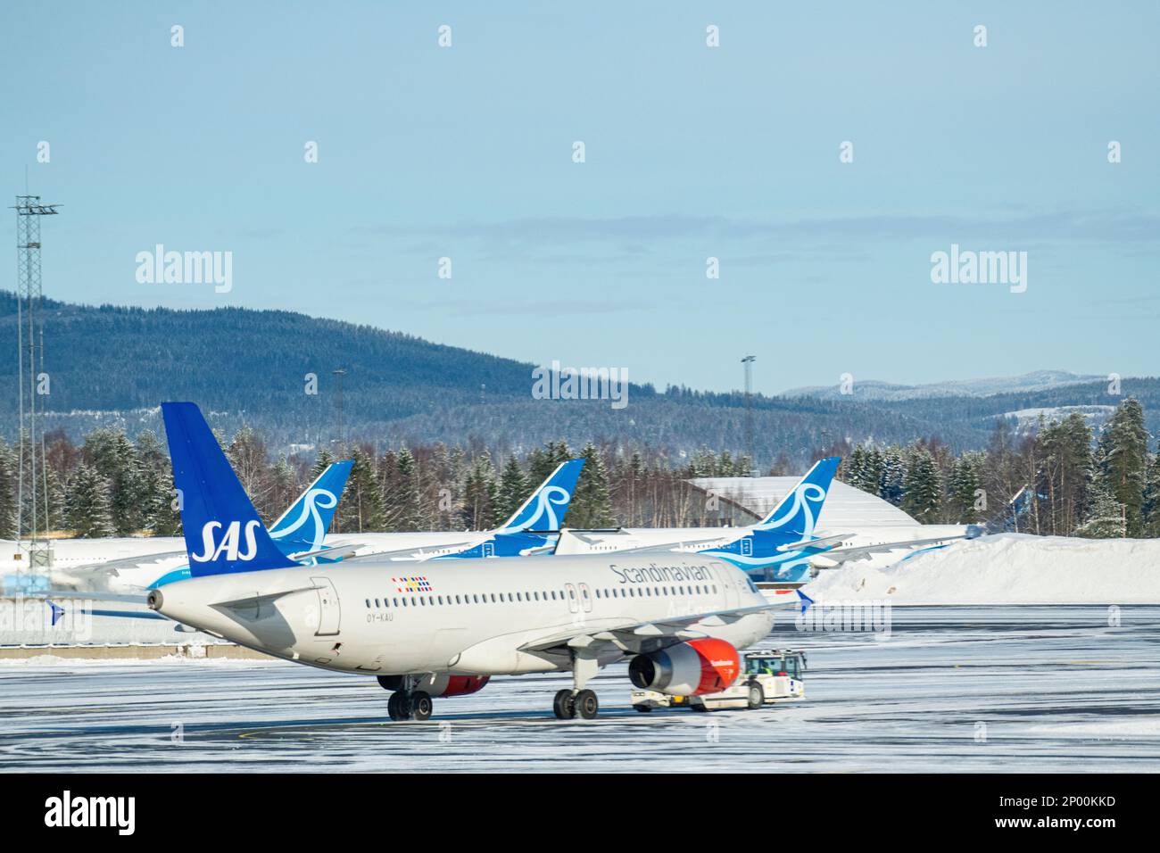 A Scandanavian Airlines plane in front of some Norse Atlantic Airways ...