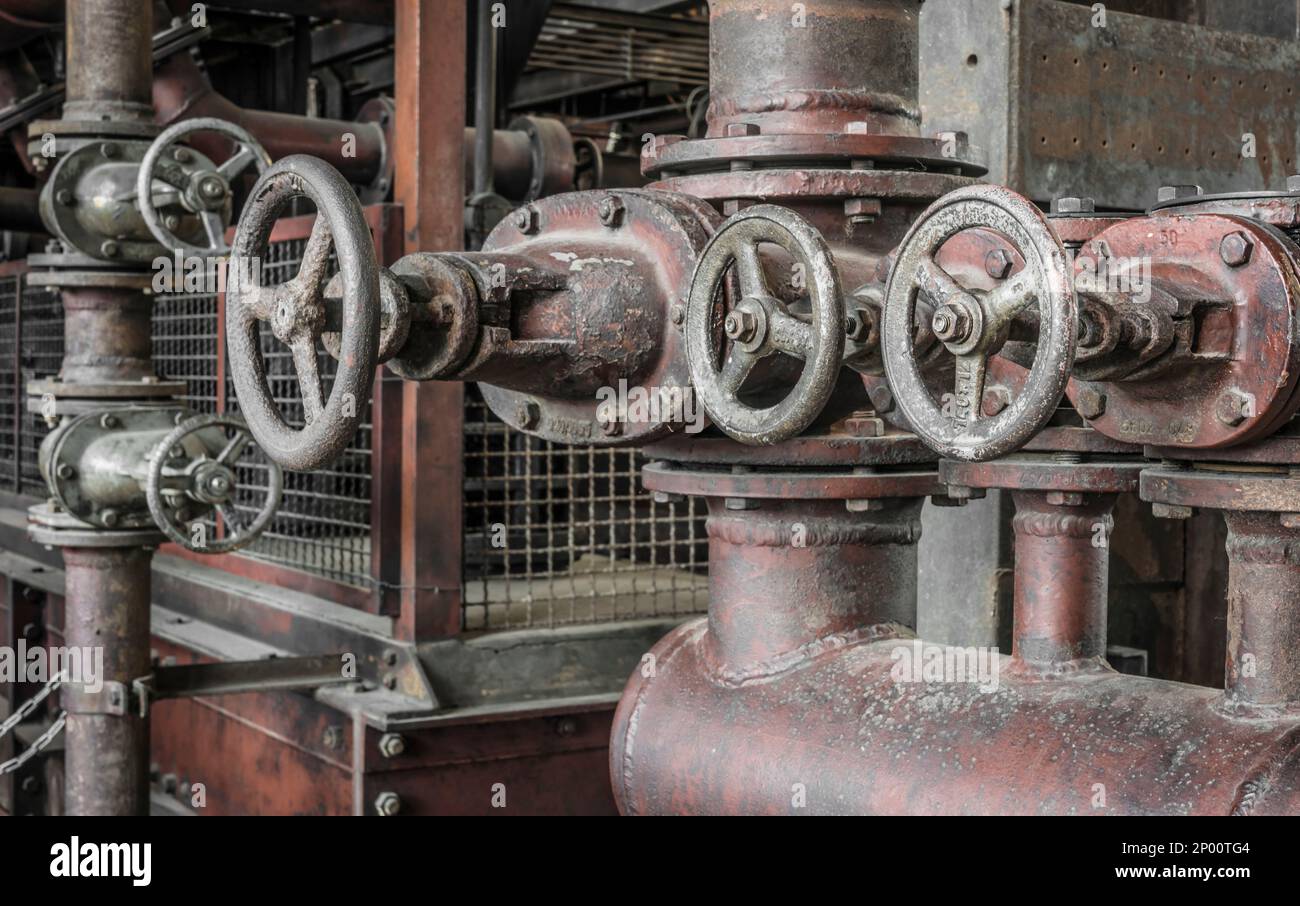 hydraulic pipes of a historic machine Stock Photo - Alamy