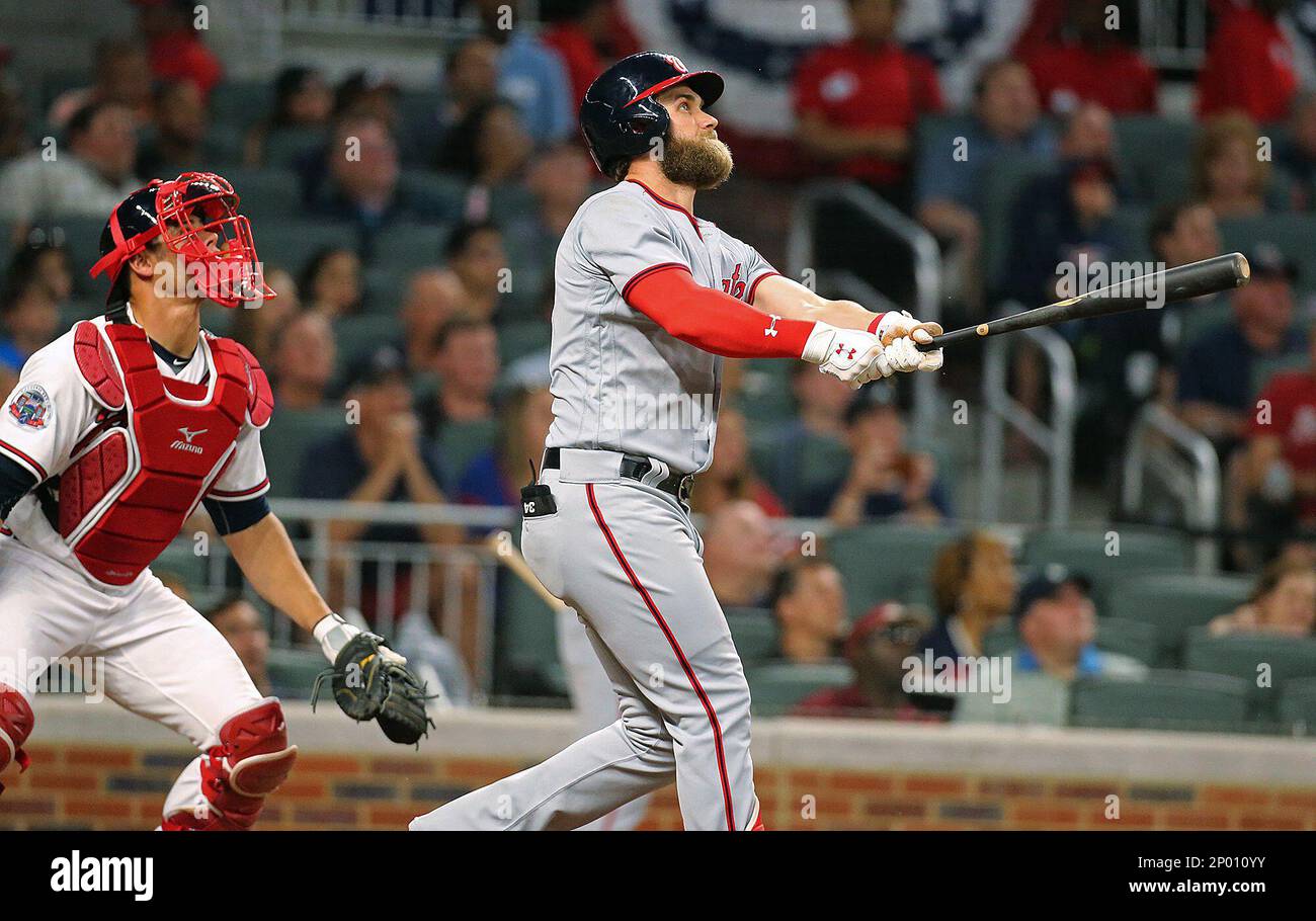Washington Nationals' Bryce Harper watches his grand slam, next to ...