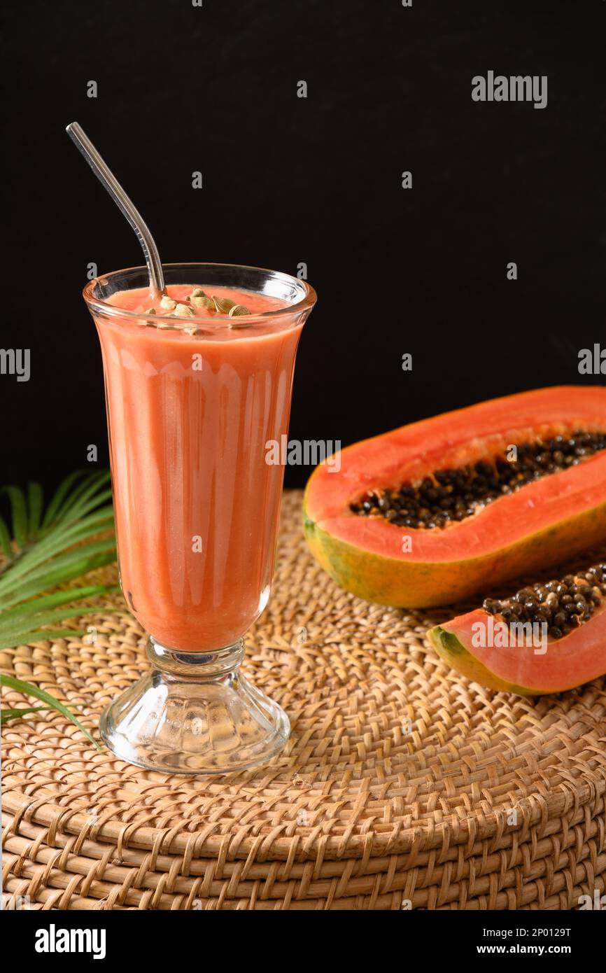 Asian traditional papaya lassi on dark background. Freshness cold ...