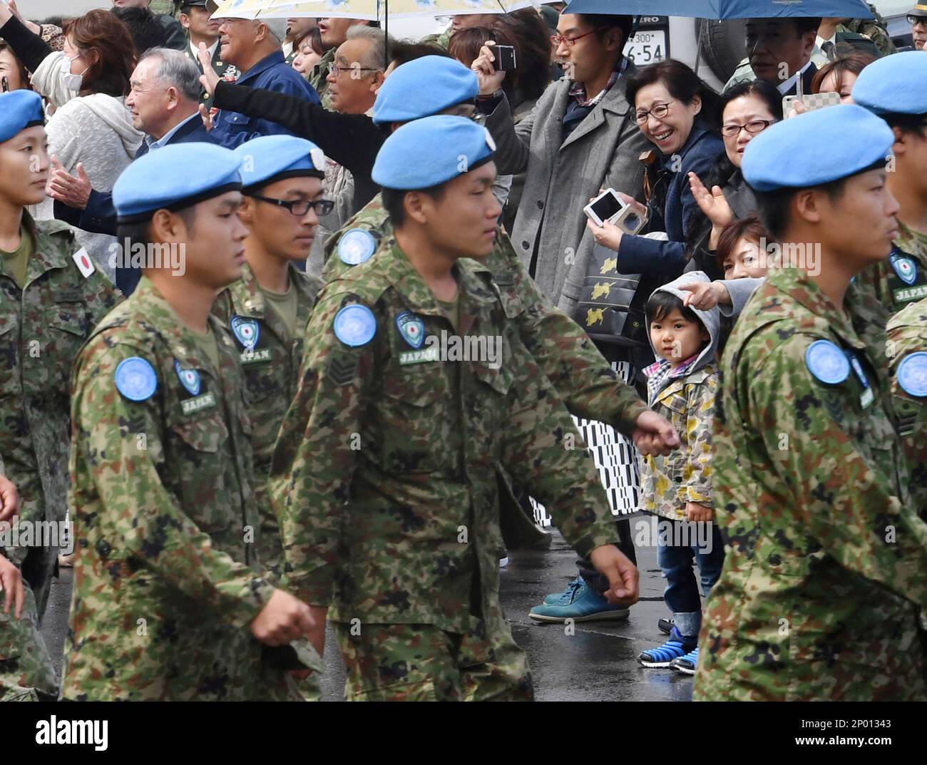 Members of Japanese Ground Self-Defense Force (JGSDF) are welcomed by ...
