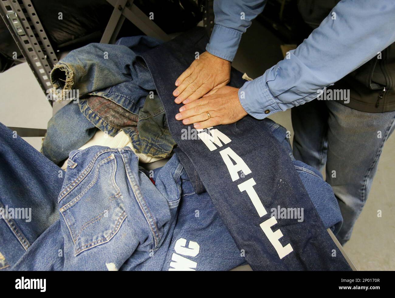 Mark Oberle ponders how to reuse clothing ones designed for inmates at ...