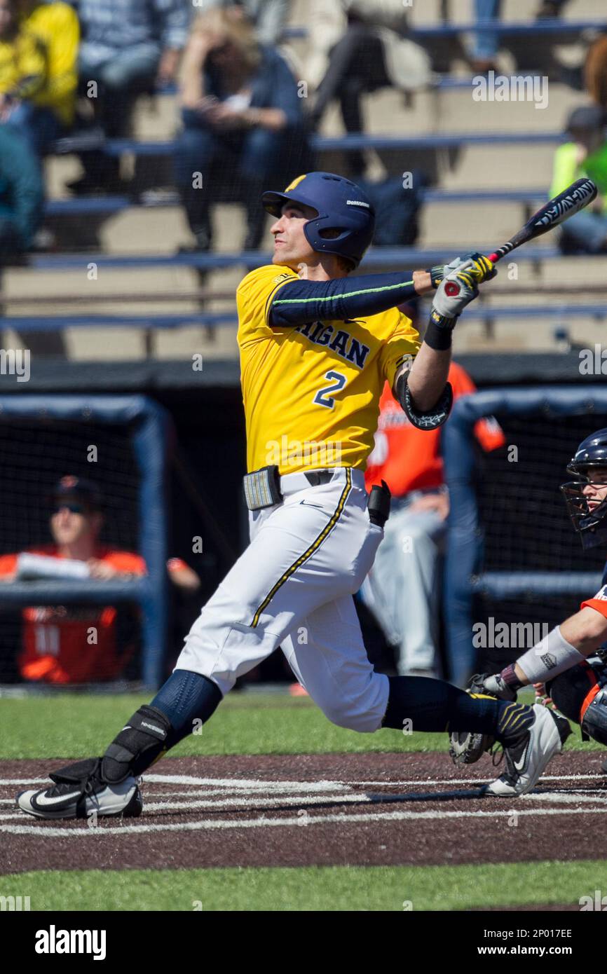 Michigan Wolverines outfielder Jonathan Engelmann (2) follows through ...