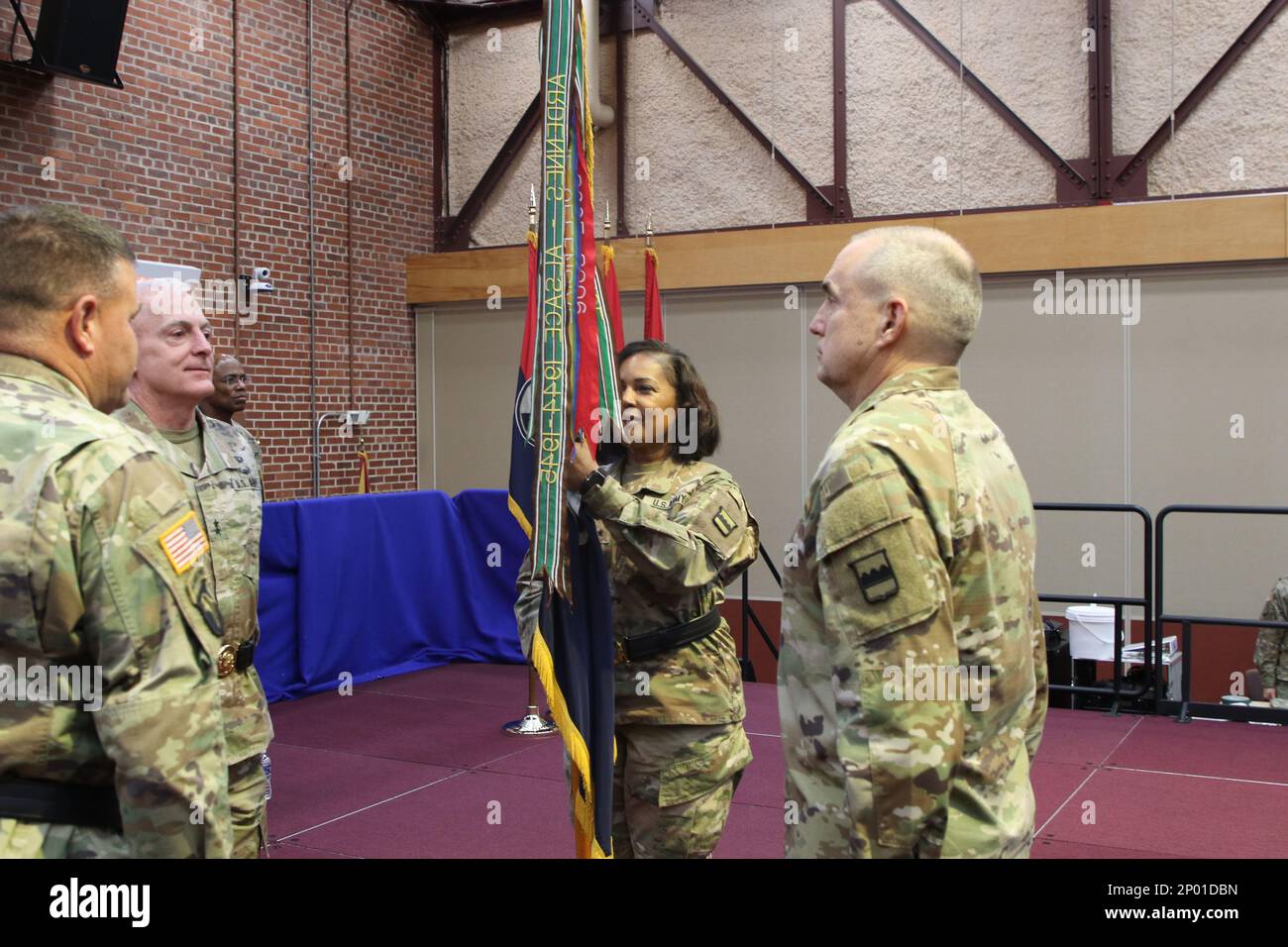 Brig. Gen. Patricia Wallace stands holding the unit colors of the 80th ...