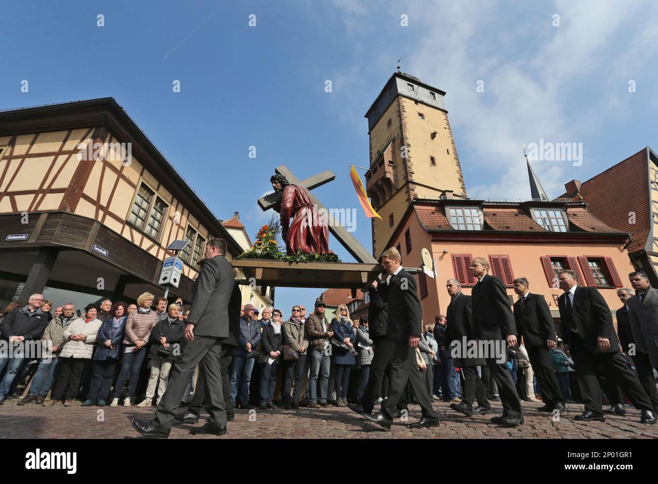 People attend a Good Friday procession, in Lohr am Main, Germany ...
