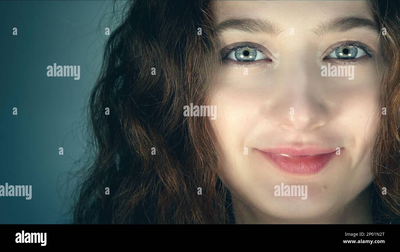 Young girl smiling with charming eyes Photo Stock Photo - Alamy