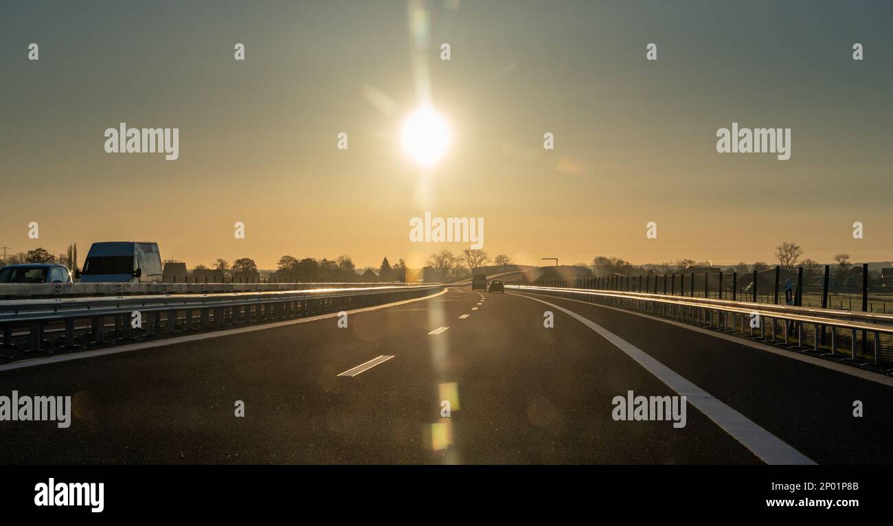 Driving into the sun at a German Autobahn. Symbol for the danger of ...