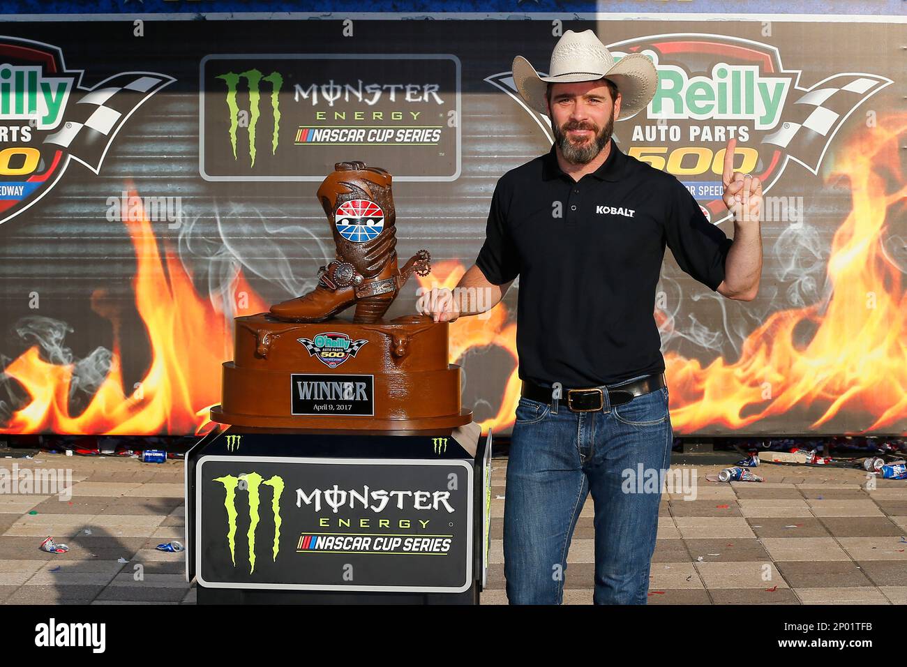 Jimmie Johnson celebrates in victory lane after winning the NASCAR O ...