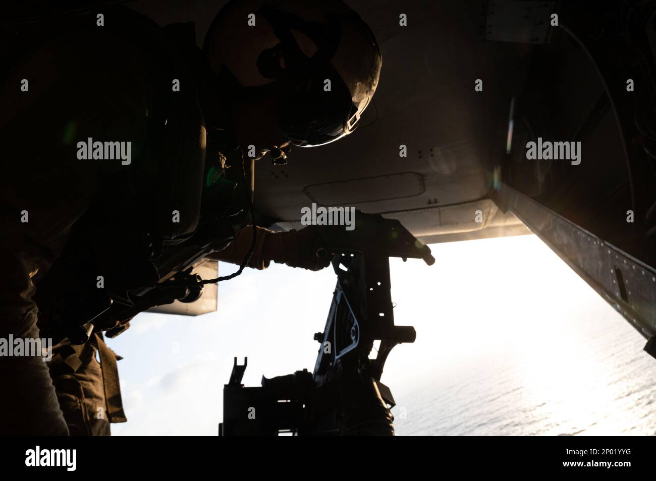 A U.S. Marine Corps MV-22 Osprey crew chief assigned to Marine Medium Tiltrotor Squadron 266 ...