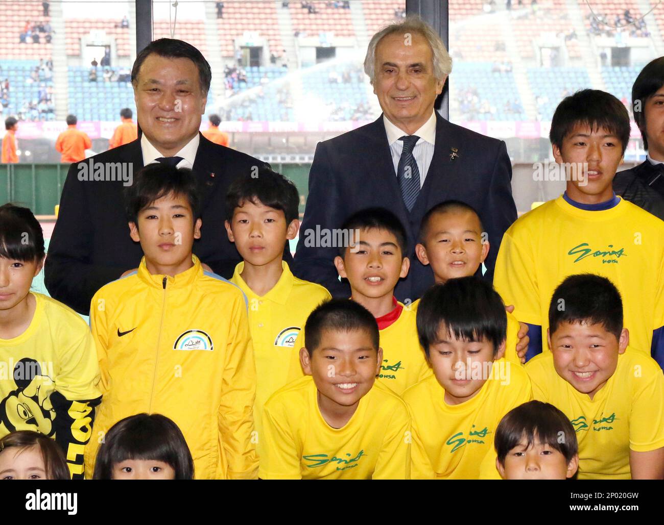 Japan's soccer natonal team coach Vahid Halilhodzic (R), and Kohzo Tashima pose with players of ...