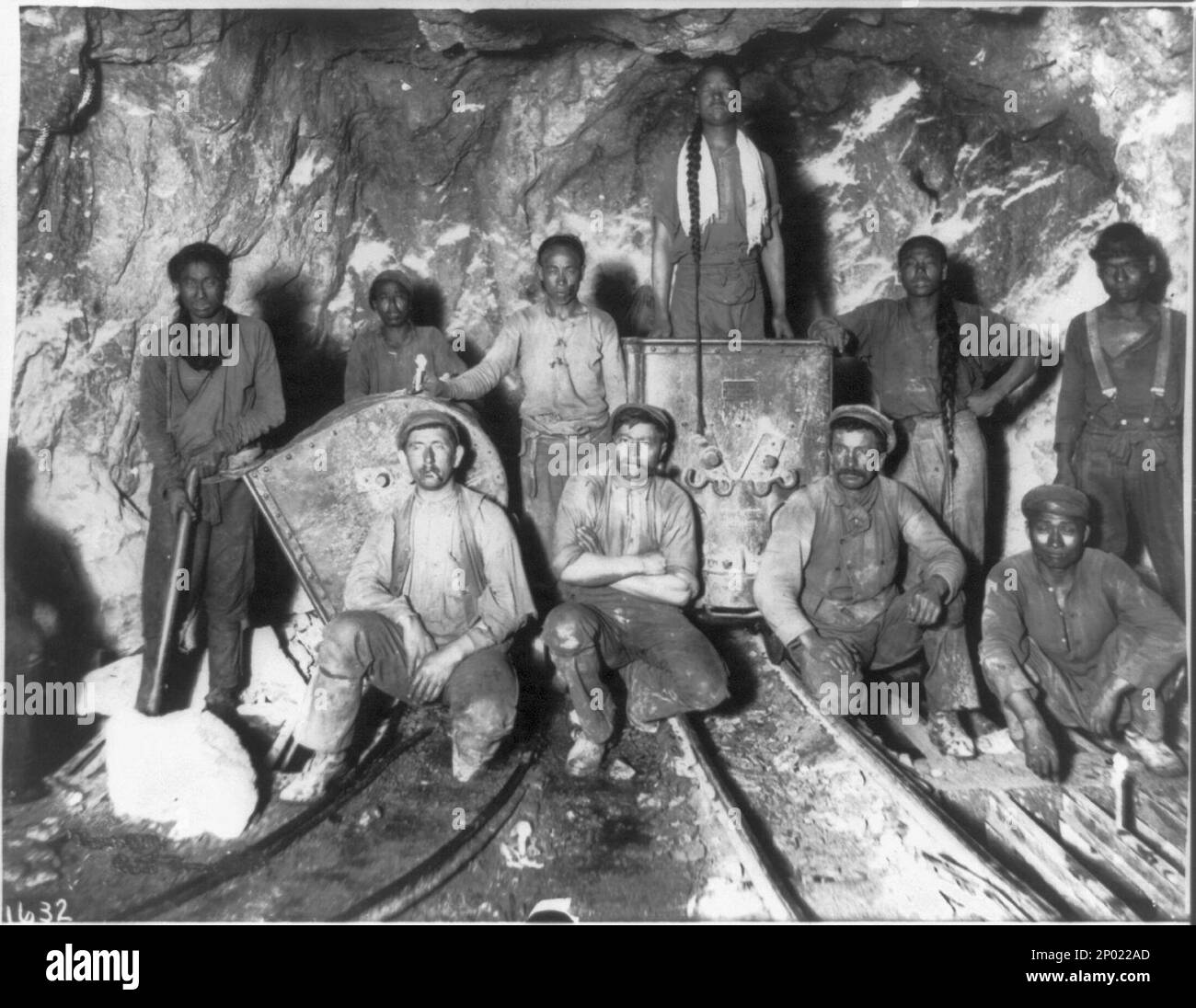 Black, Chinese and White laborers in a gold mine in South Africa. South ...