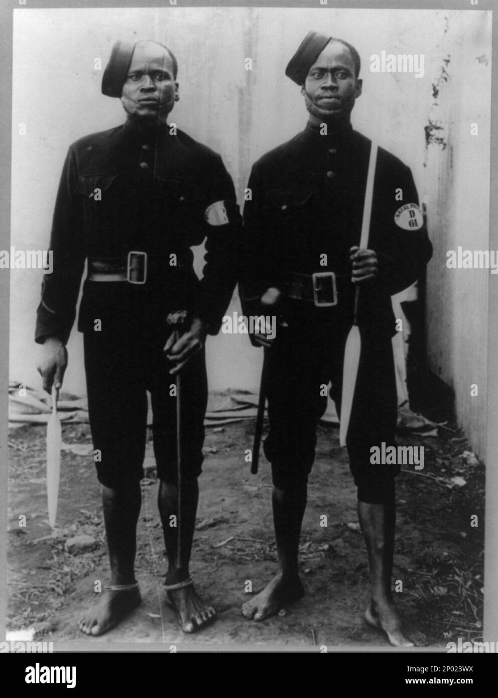 2 barefooted policemen posed full lgth., Capetown, South Africa. South ...