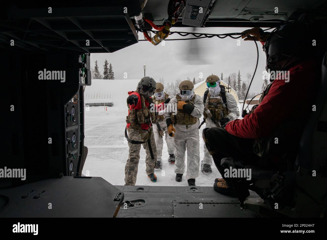 Alaska Army Guard Spc. Matthew Tucker, left, a flight medic, and Staff ...