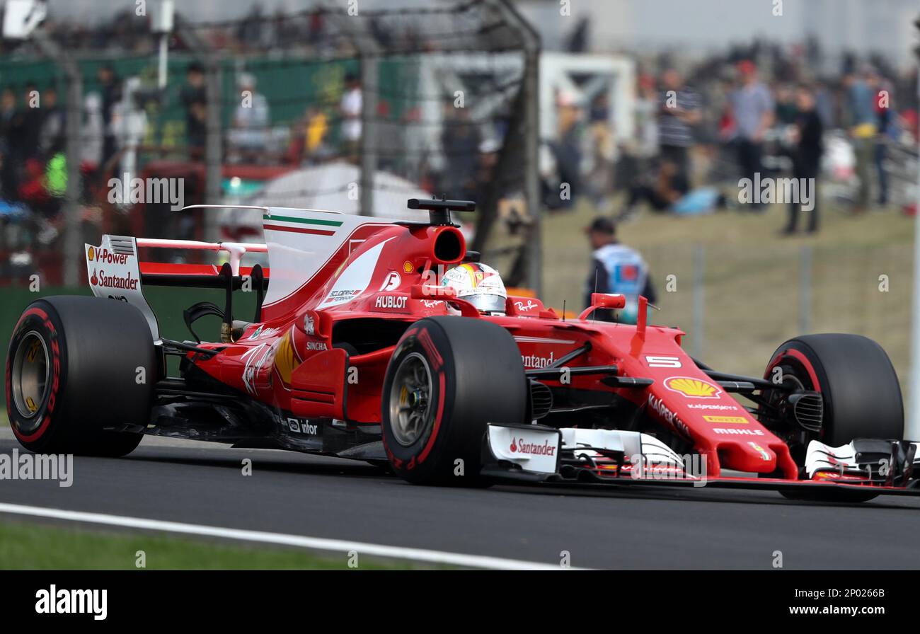 German F1 Sebastian Vettel of Ferrari steers his car during the ...