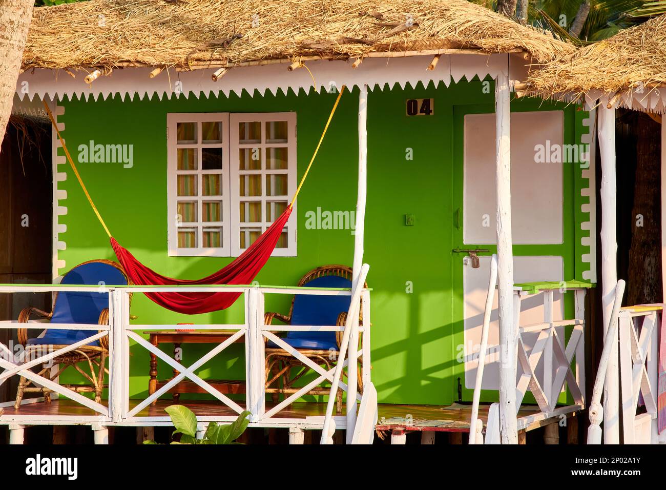 Beatiful green beach hut with a red hammock at Palolem Beach in Goa ...
