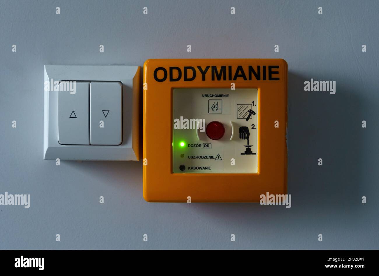 Orange box that activates the fire alarm and smoke extraction system ...
