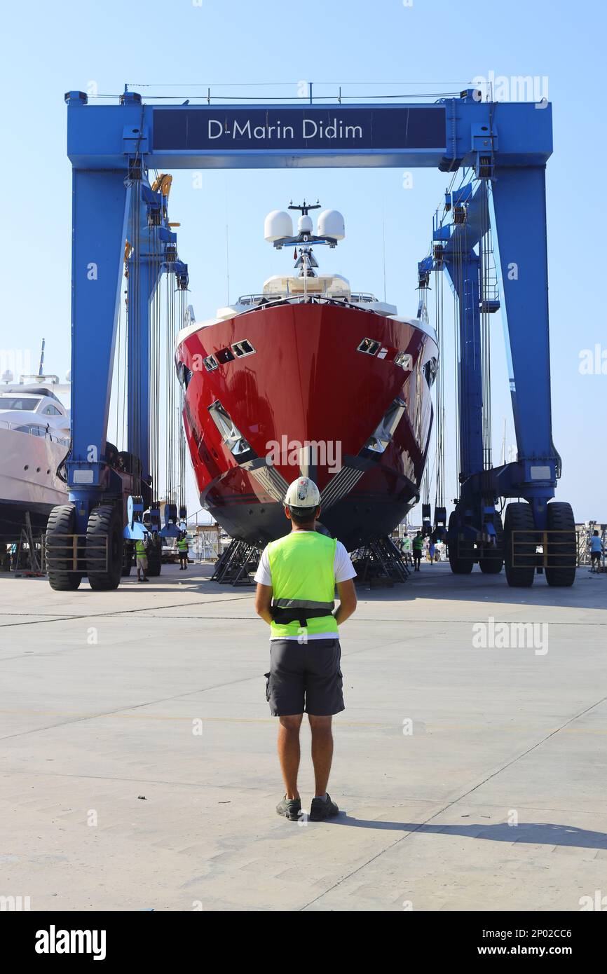 Didim, Aydin, Turkey. 20 June 2022: The mega yacht is lifted by a large ...