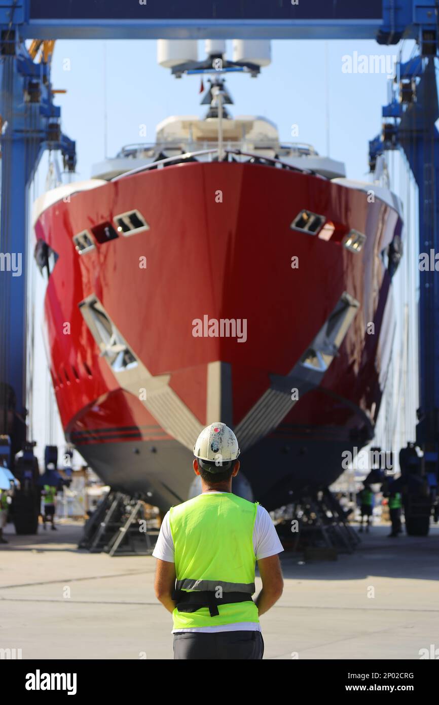 Didim, Aydin, Turkey. 20 June 2022: The mega yacht is lifted by a large ...