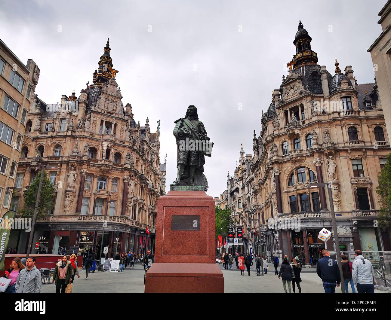 People walking in Teniersplaats with a David Teniers statue surrounded ...