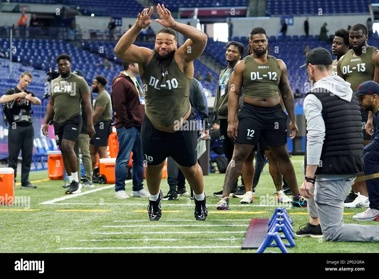 Penn State defensive lineman PJ Mustipher runs a drill at the NFL ...