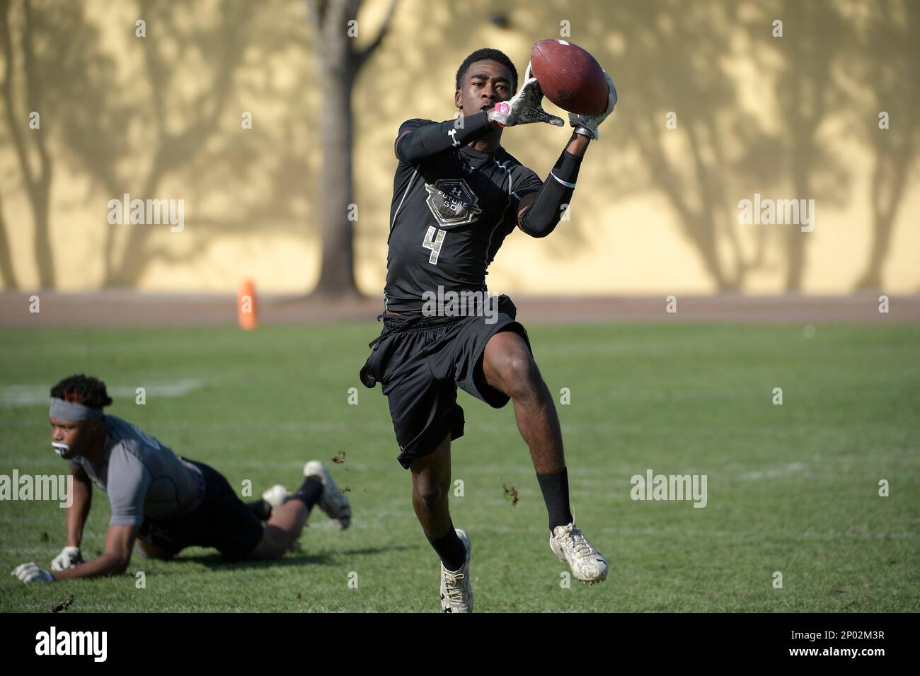 Receiver Justin Watkins (4) catches a pass in front of defensive back ...