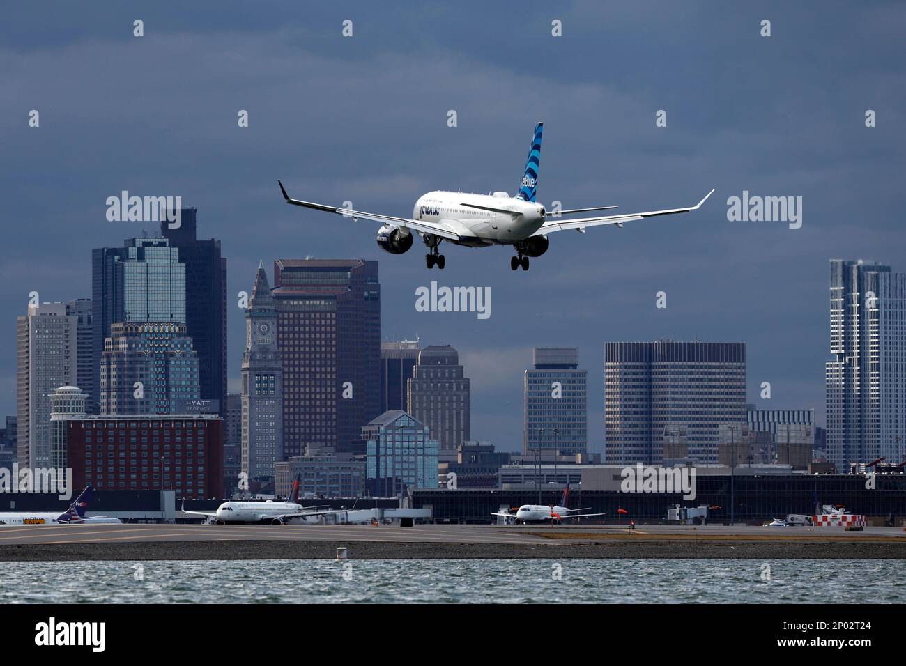 FILE - A JetBlue plane lands at Logan International Airport, Thursday ...
