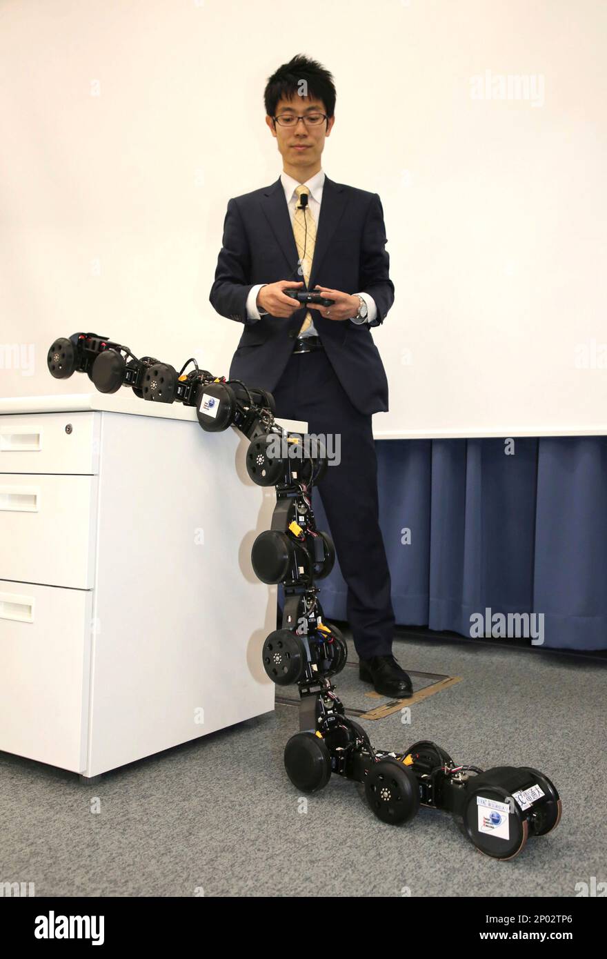 T2 Snake-3 robot, operated by wireless remote control, wiggles on the ...