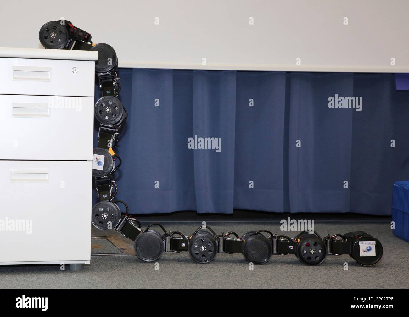 T2 Snake-3 robot, operated by wireless remote control, wiggles on the ...