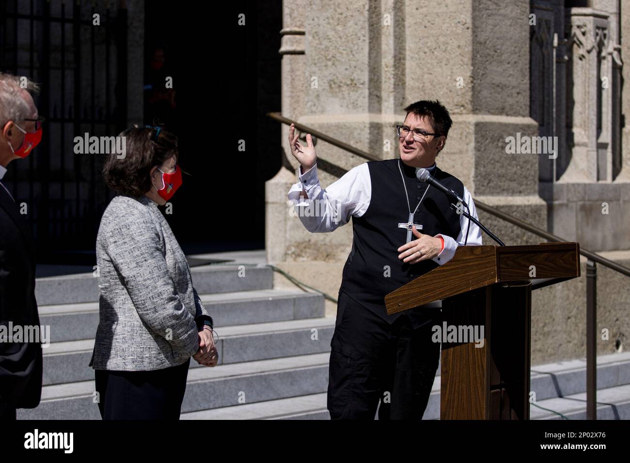 FILE - Bishops Marc Andrus, left, and Elizabeth Eaton, center, listen ...