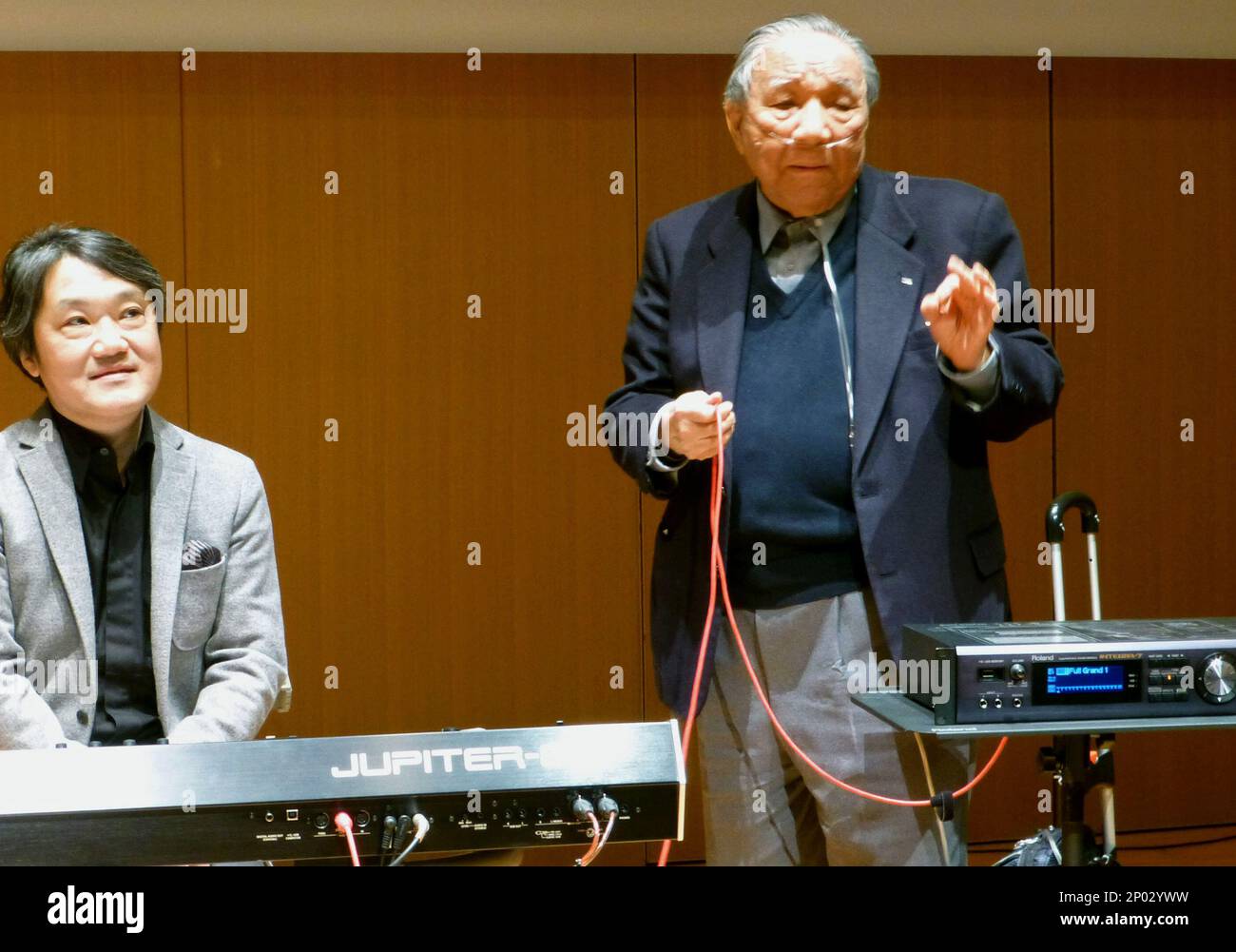 In this Jan. 11, 2013 photo, Ikutaro Kakehashi, right, speaks next to composer Akira Senju ...