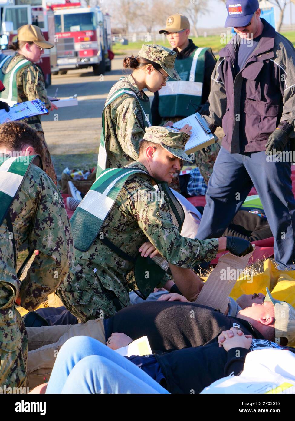 A Naval Health Clinic Lemoore Hospital Corpsman treats an "injury" as ...