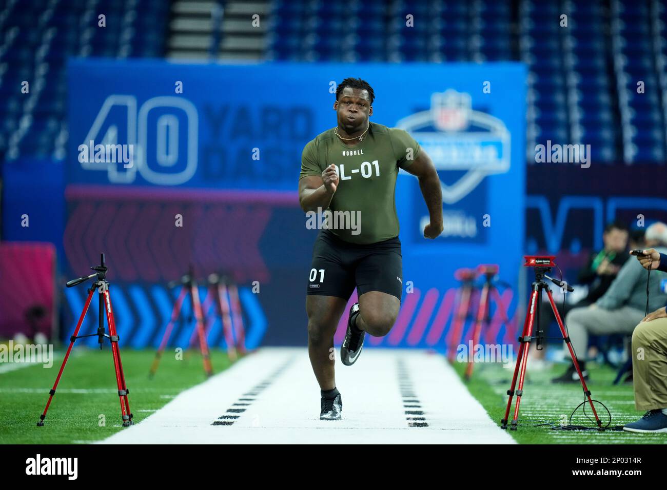 Wisconsin defensive lineman Keeanu Benton runs the 40-yard dash at the ...