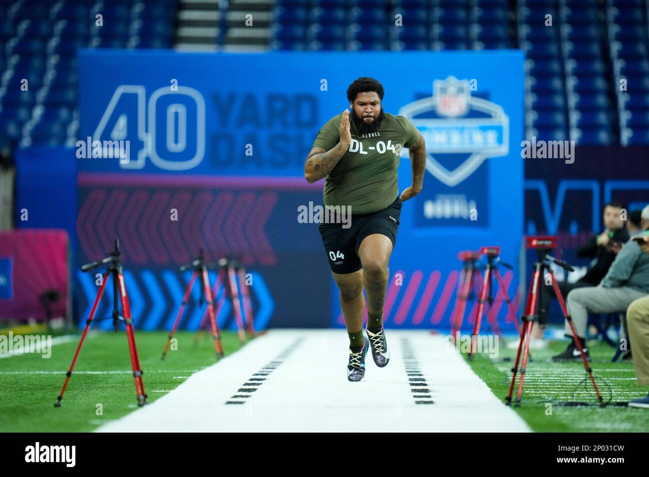 Coastal Carolina defensive lineman Jerrod Clark runs the 40-yard dash ...