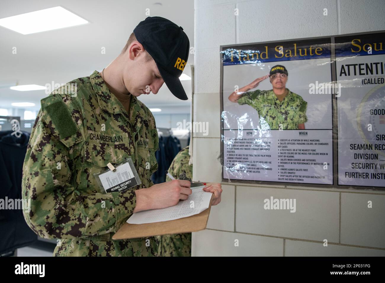 Recruits read their Recruit Training Guide for Basic Military Training ...