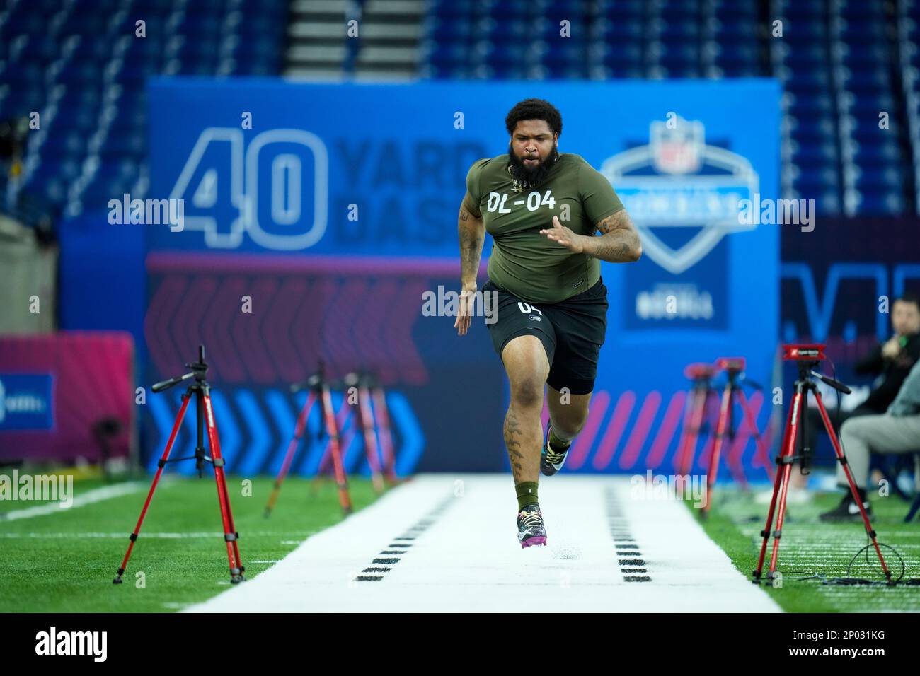 Coastal Carolina defensive lineman Jerrod Clark runs the 40-yard dash ...