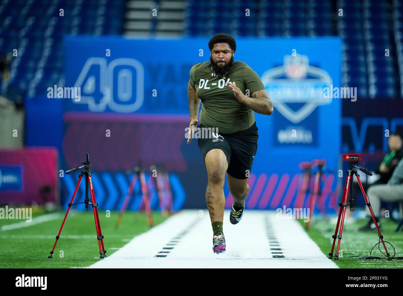 Coastal Carolina defensive lineman Jerrod Clark runs the 40-yard dash ...