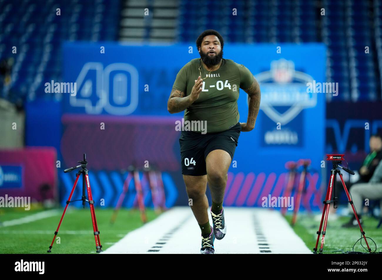 Coastal Carolina defensive lineman Jerrod Clark runs the 40-yard dash ...