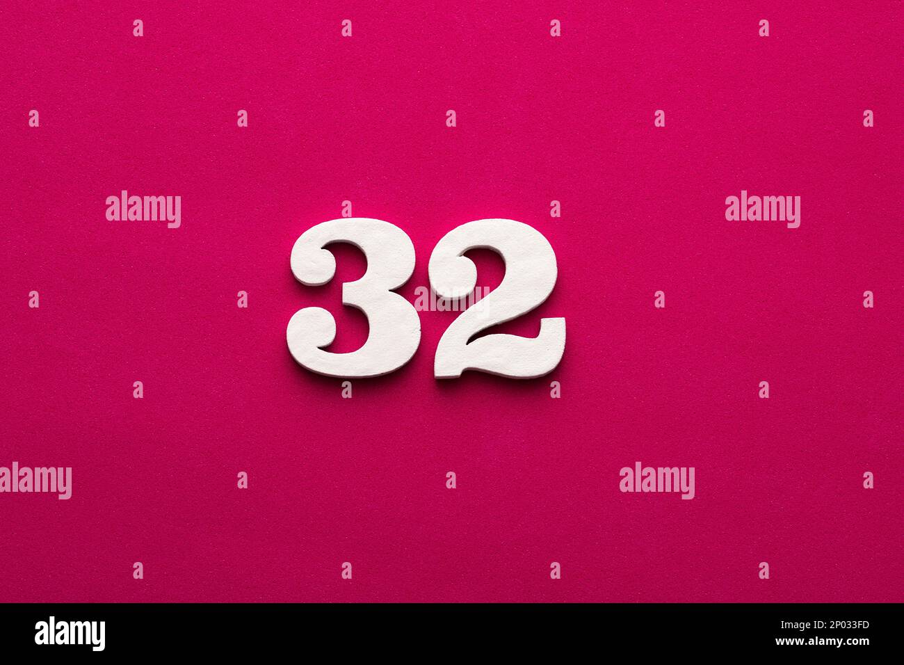 Number 32 - White wooden number on rhodamine red background Stock Photo ...