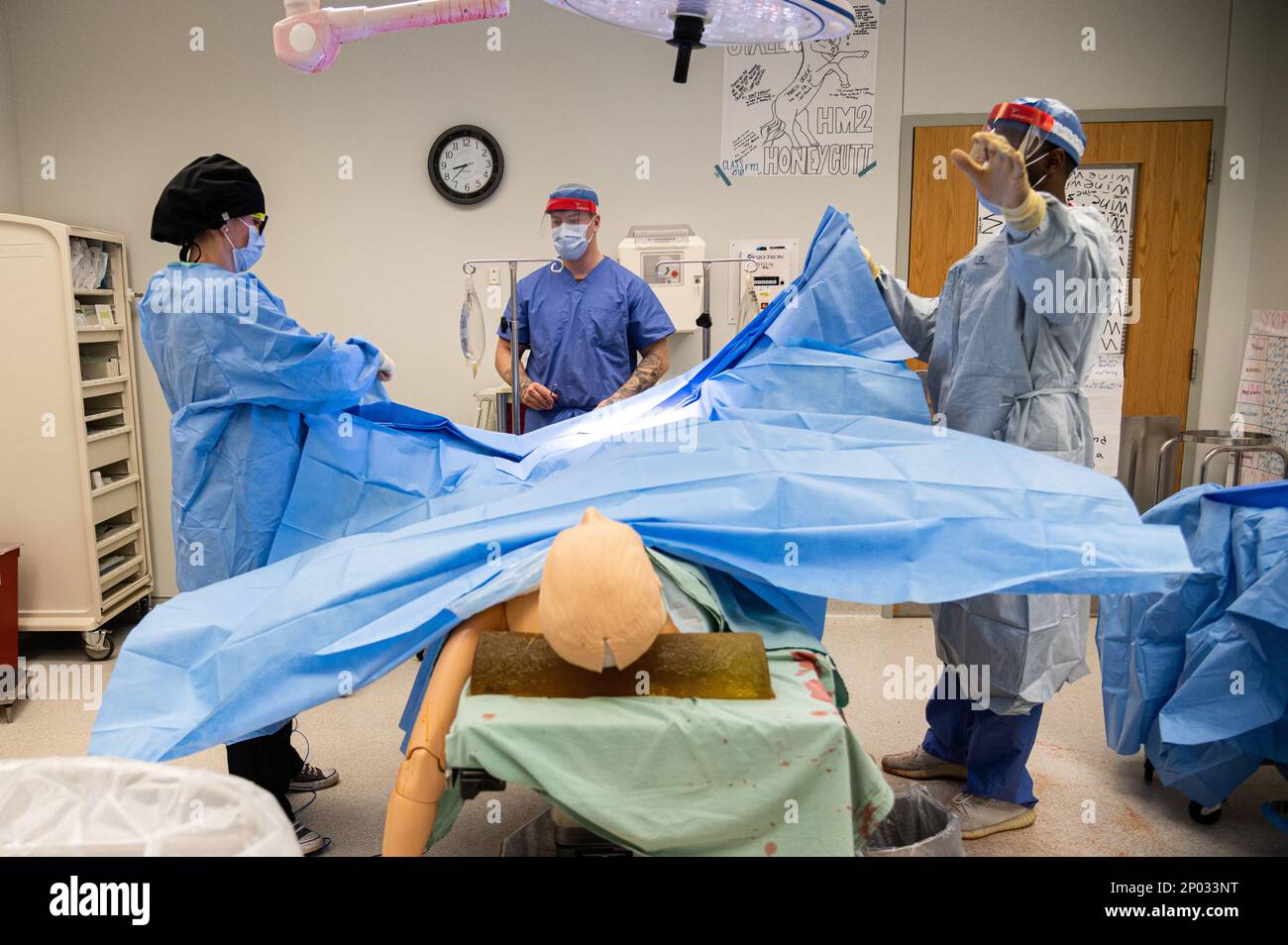 Instructors act as surgeons during a mock surgery while 68D operating ...