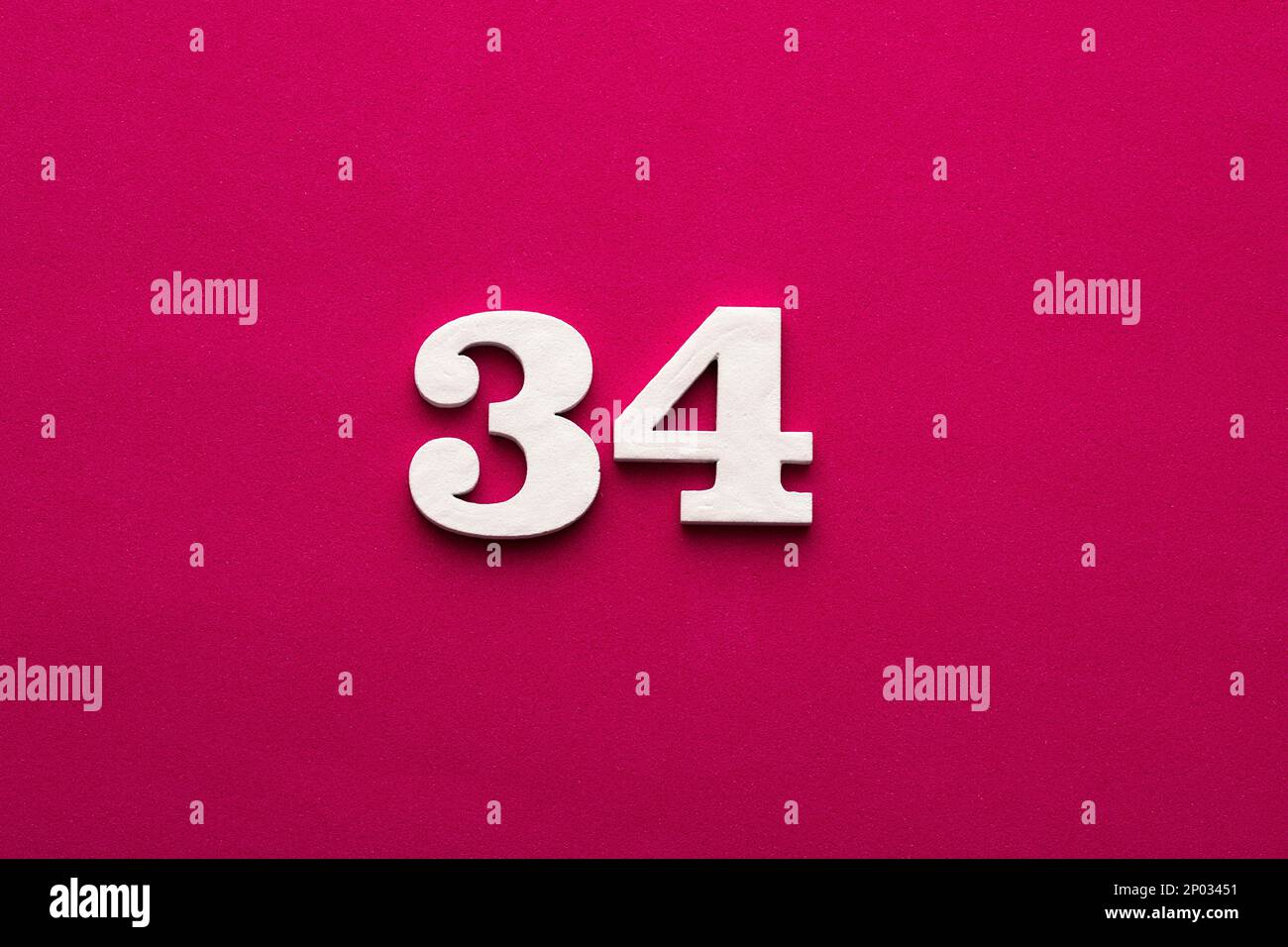 Number 34 - White wooden number on rhodamine red background Stock Photo ...