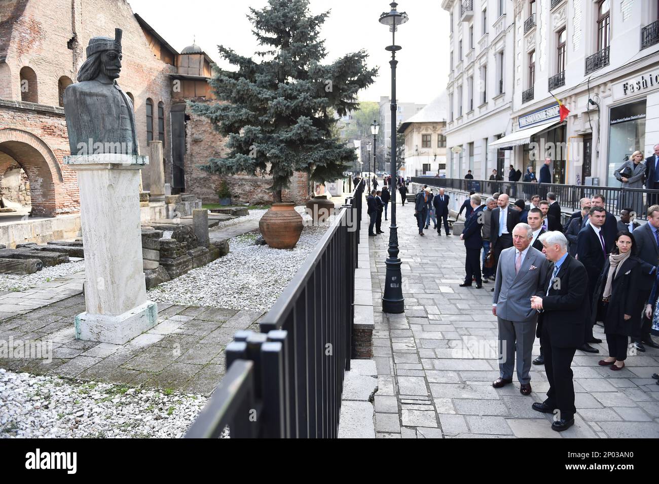 Britain's Prince Charles, second from right, stands in front of a bust ...